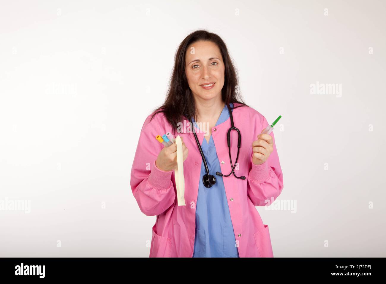 Compassionate looking phlebotomist holding a turnakit, needle and blood ...