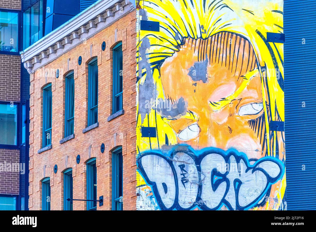 Graffiti urban art in the lateral wall of a colonial building Stock ...