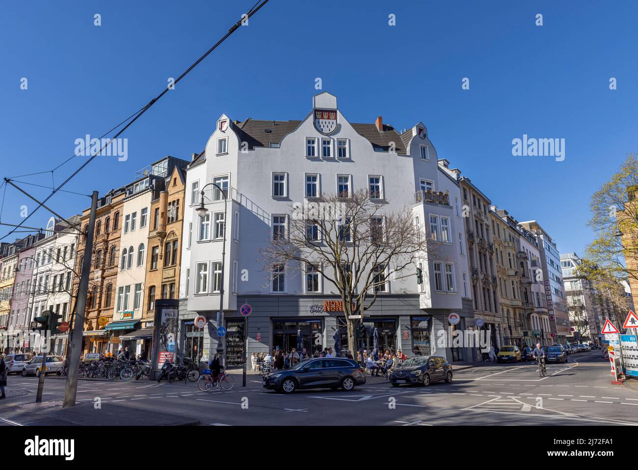 Cologne downtown with tourists walking on streets in a bright spring ...