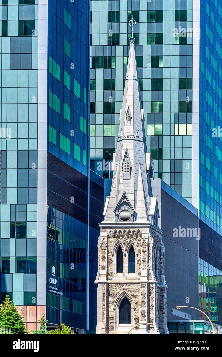 Architectural contrast of a church spire with modern skyscrapers Stock ...