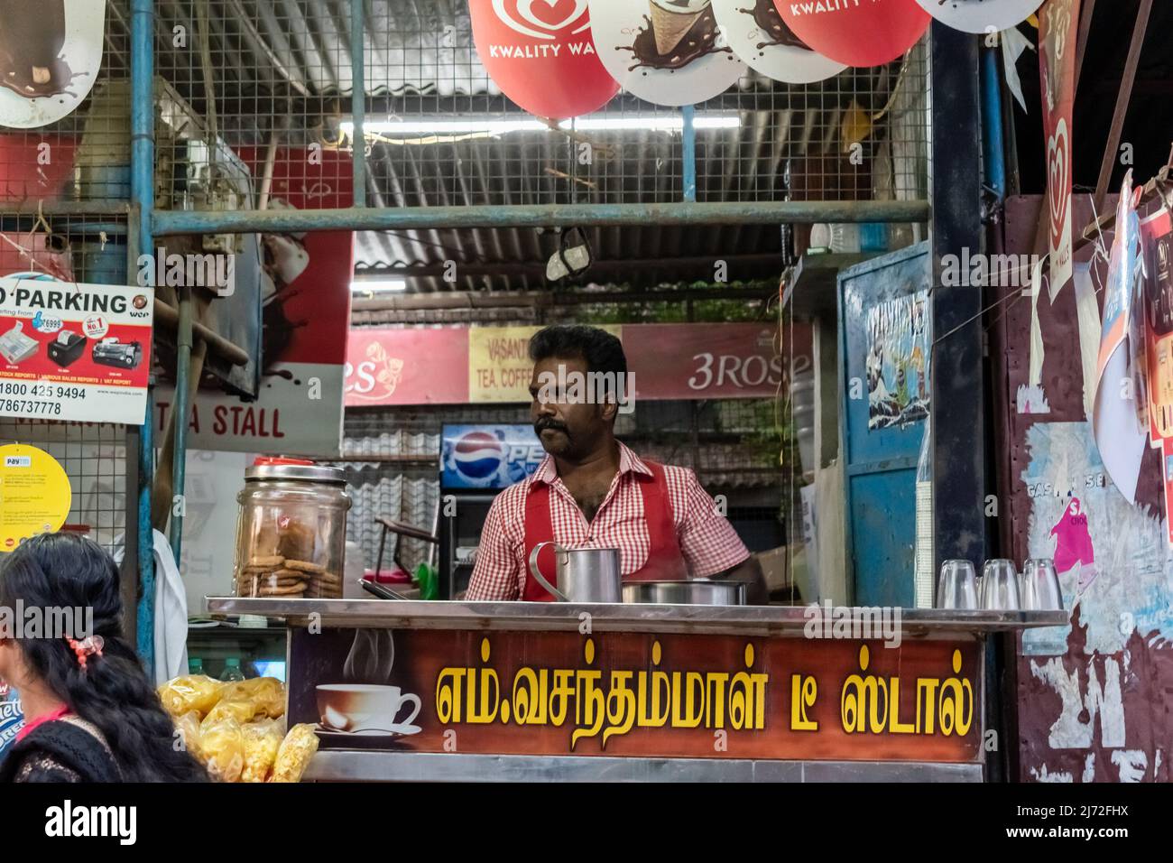 Vellore, Tamil Nadu, India - September 2018: An Indian male street vendor selling tea at his ...
