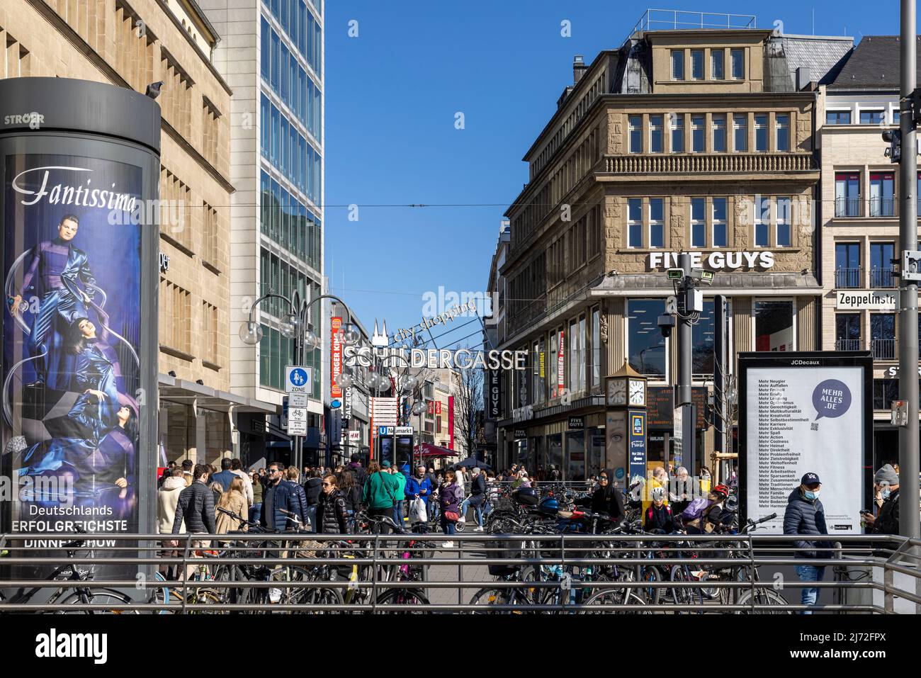 Cologne downtown with tourists walking on streets in a bright spring ...