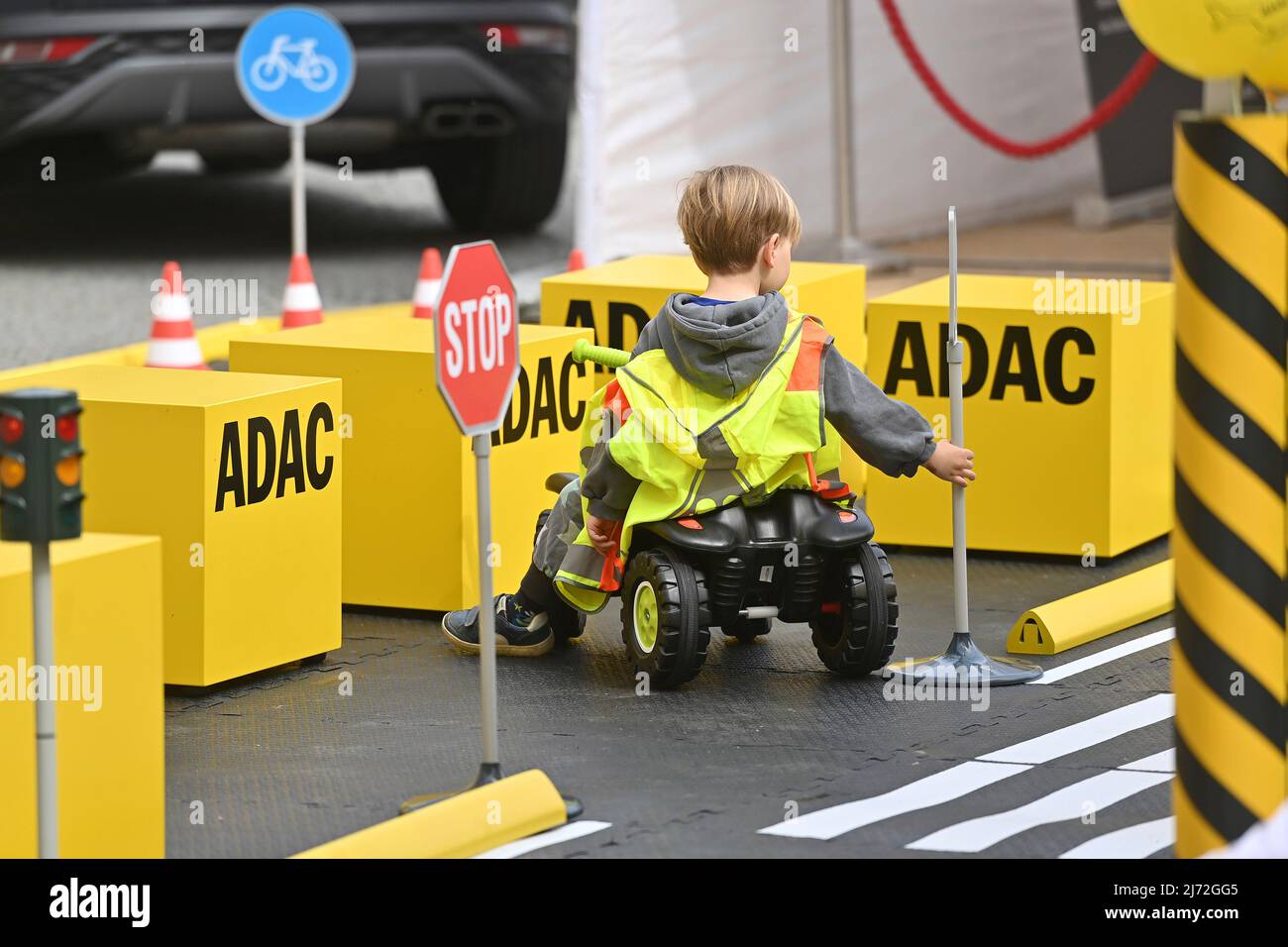 Children drive on bobby cars on a course on the occasion of an ADAC ...