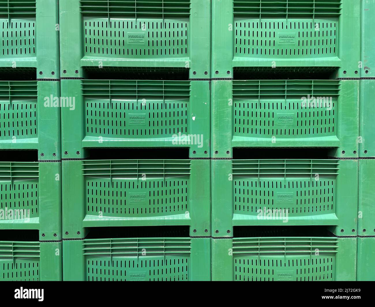 Stack of green color new plastic packaging crates background Stock ...