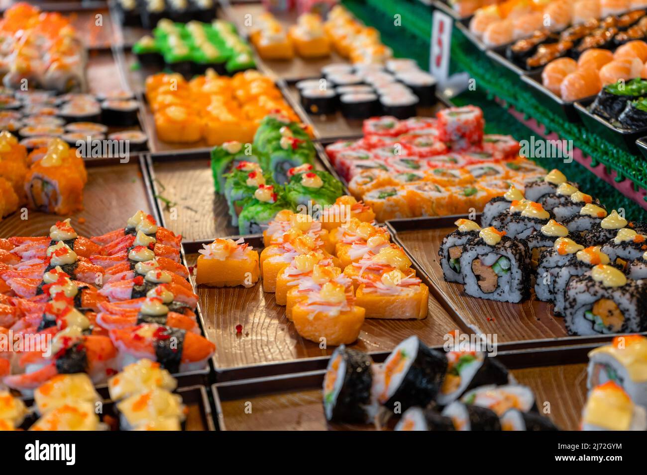 Night food market in asia. Outdoor sushi counters Stock Photo - Alamy