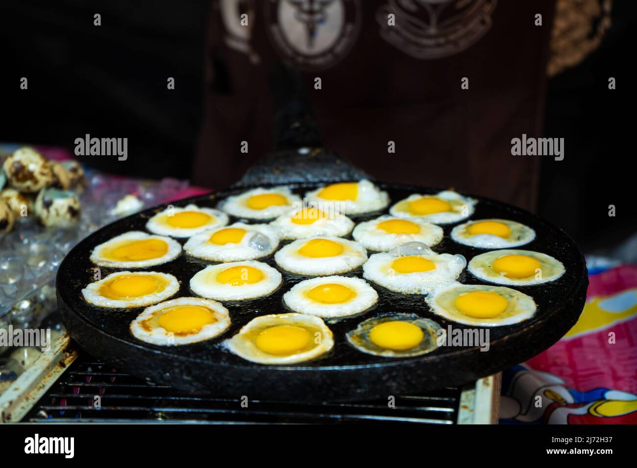 street food in Thailand. Fried eggs. Scrambled eggs for take away Stock ...
