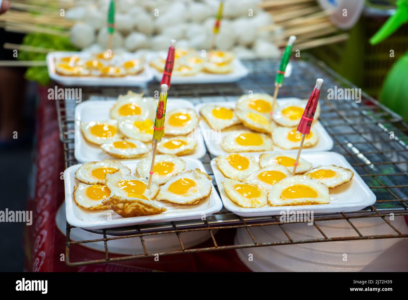 street food in Thailand. Fried eggs. Scrambled eggs for take away Stock ...