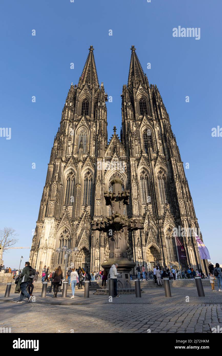 Cologne Cathedral twin towers rising above city skyline on a bright ...