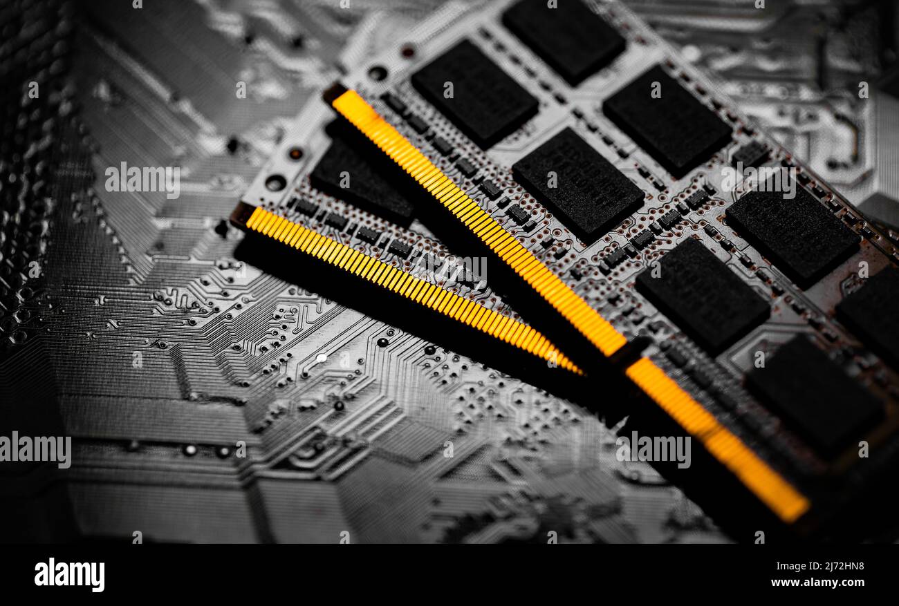 Macro Close up of computer RAM chip and motherboard on dark background ...