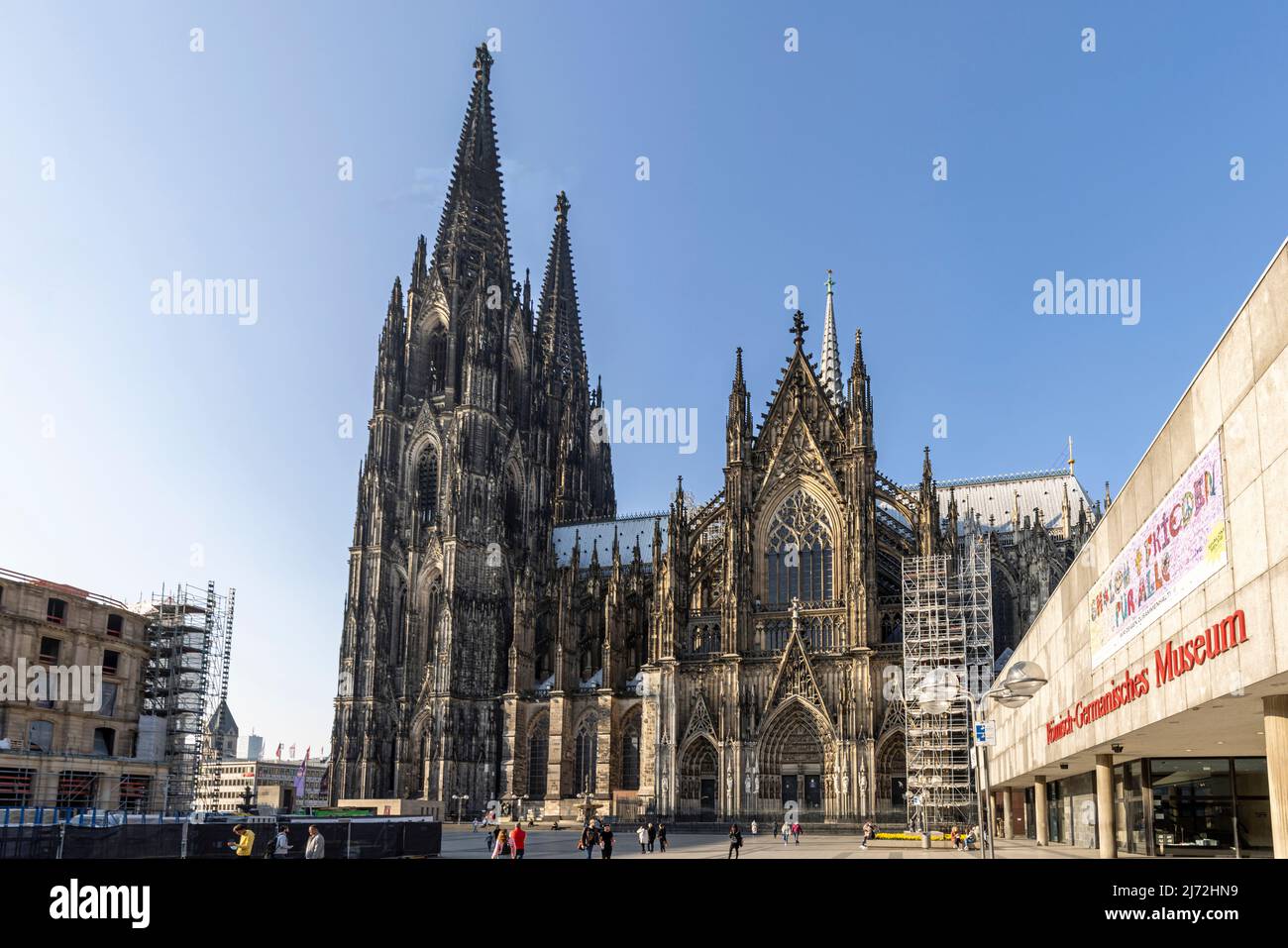 Cologne Cathedral twin towers rising above city skyline on a bright ...