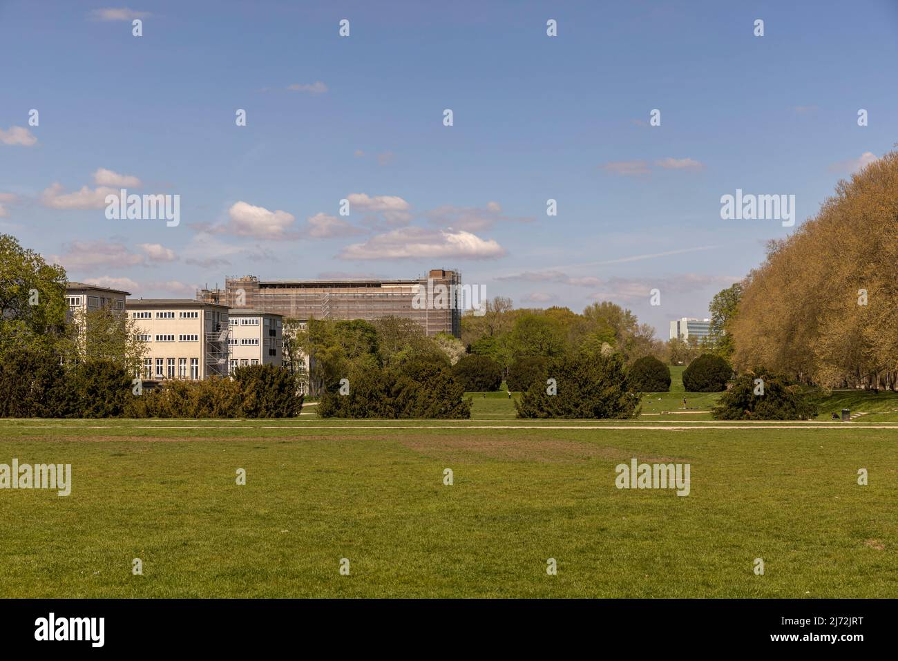 People spending time in Green Belt in Cologne on a bright spring day ...