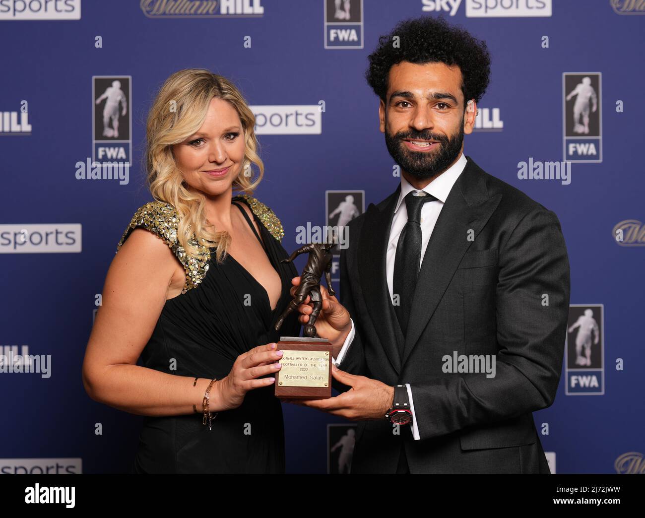 Liverpool s Mohamed Salah is presented with the FWA Player of the Year Award by FWA Chair Carrie Brown during the FWA Footballer of the Year dinner held at the Landmark Hotel London