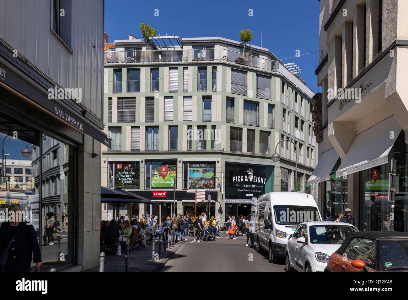 Cologne downtown with tourists walking on streets in a bright spring ...