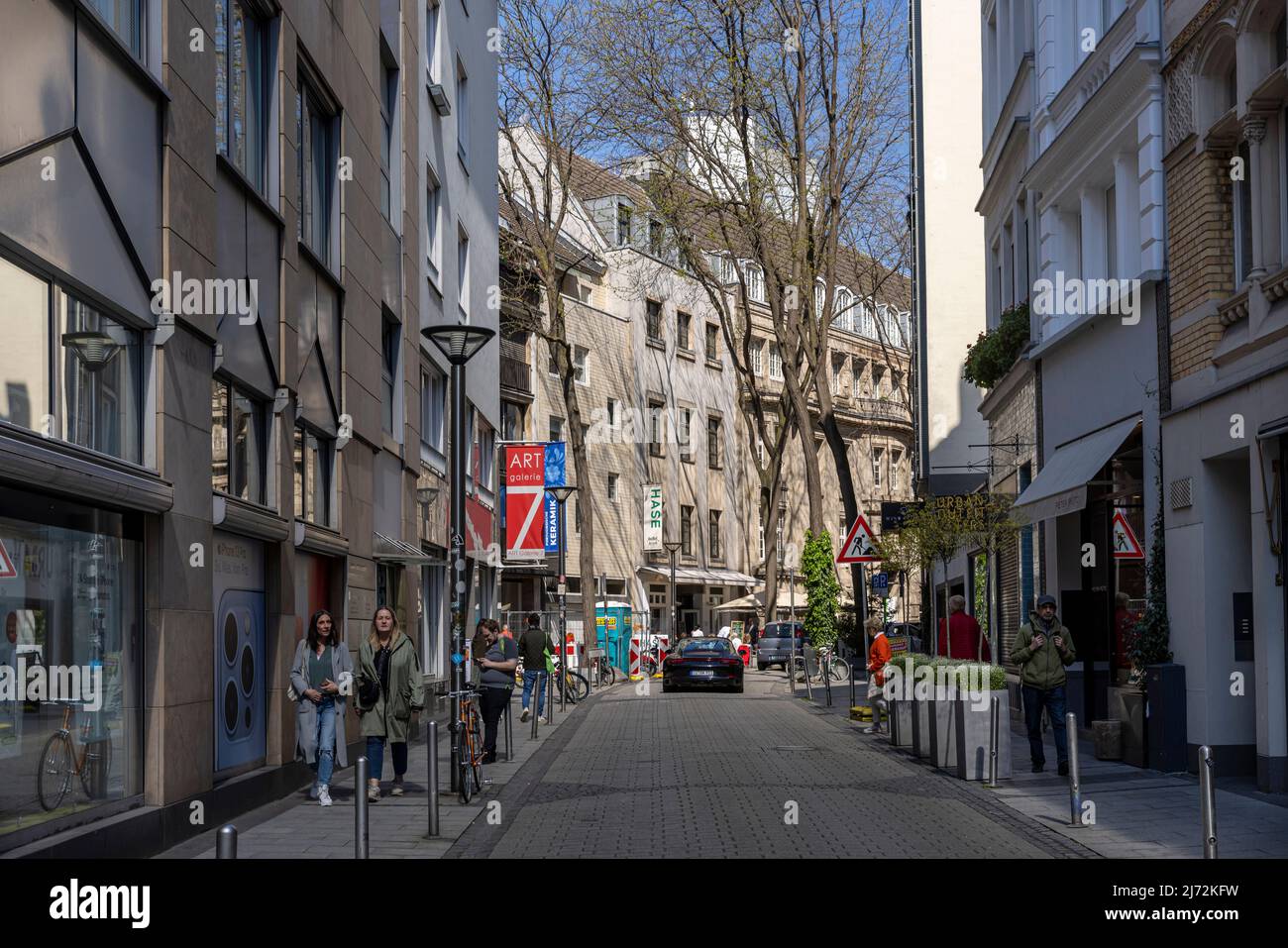 Cologne downtown with tourists walking on streets in a bright spring ...