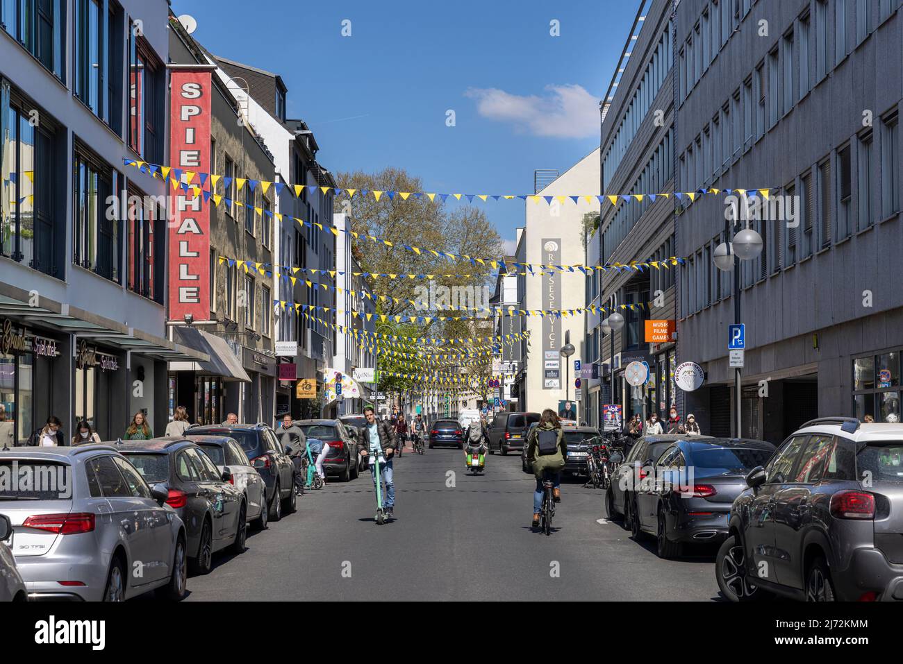 Cologne downtown with tourists walking on streets in a bright spring ...