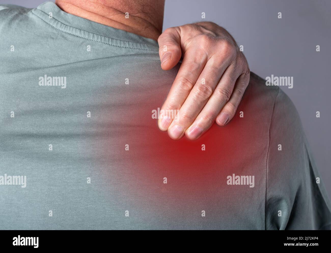 Shoulder pain closeup. Body suffering from ache in body. Red spot Stock ...