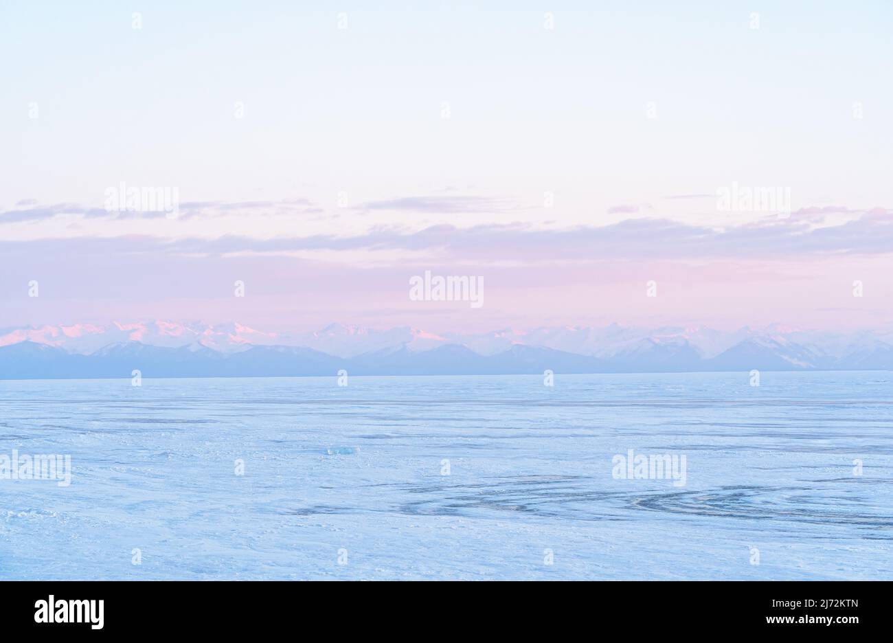 Winter landscape with mountains and Lake Baikal in Siberia at sunset ...
