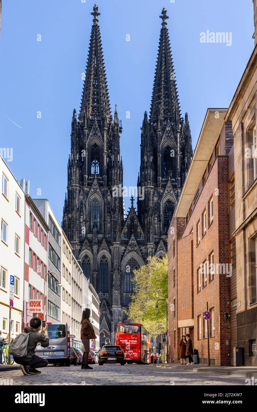 Cologne Cathedral twin towers rising above city skyline on a bright ...