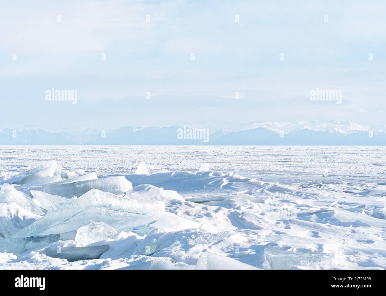 Winter landscape with mountains and Lake Baikal in Siberia at sunset ...