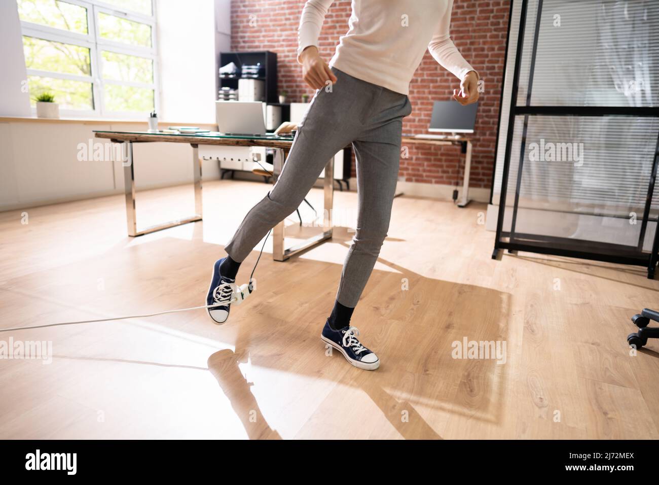 Stumble And Fall Over Wire In Office Stock Photo - Alamy
