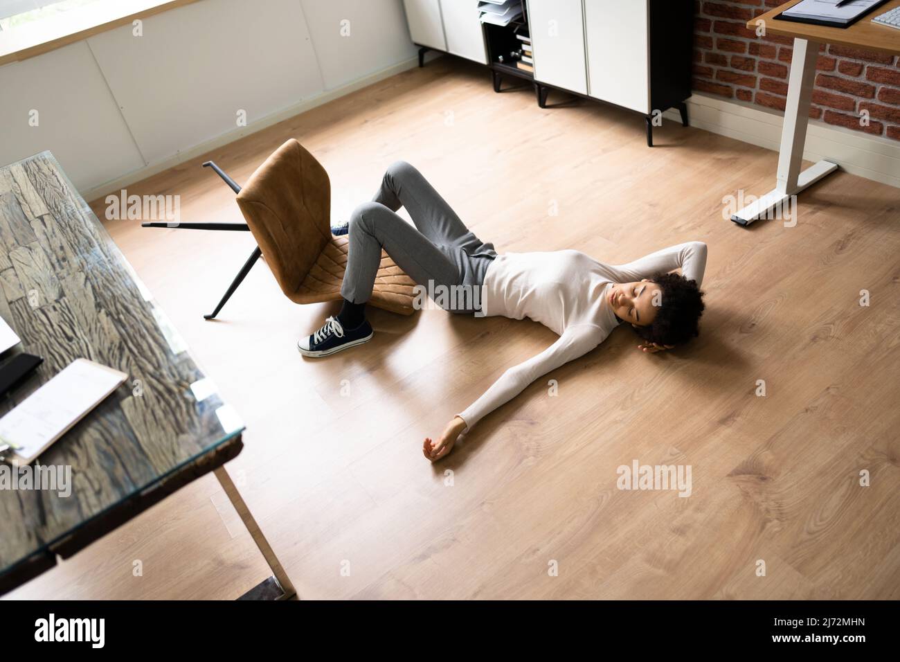 Office Slip And Fall Accident. Fainted Woman At Workplace Stock Photo ...
