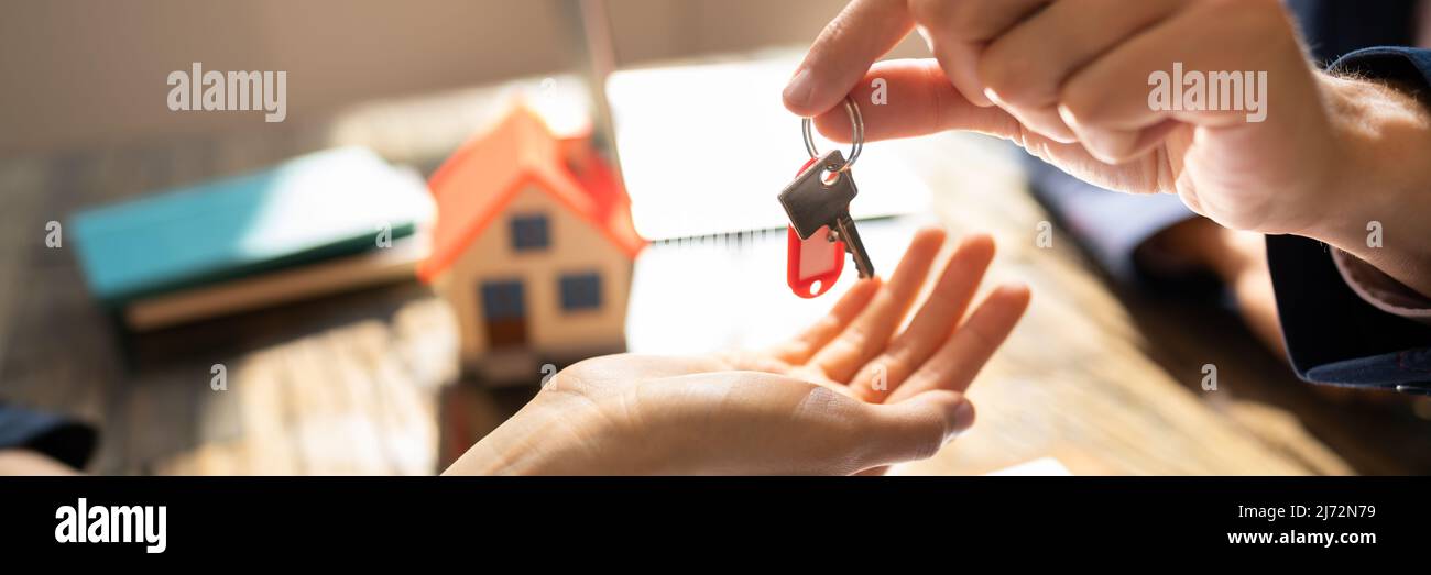 Realtor Giving House Keys To Client After Signing Contract Stock Photo ...
