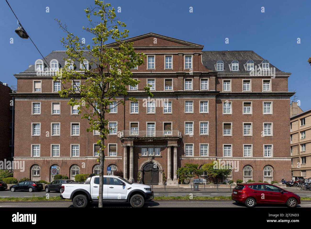 Cologne downtown with tourists walking on streets in a bright spring ...