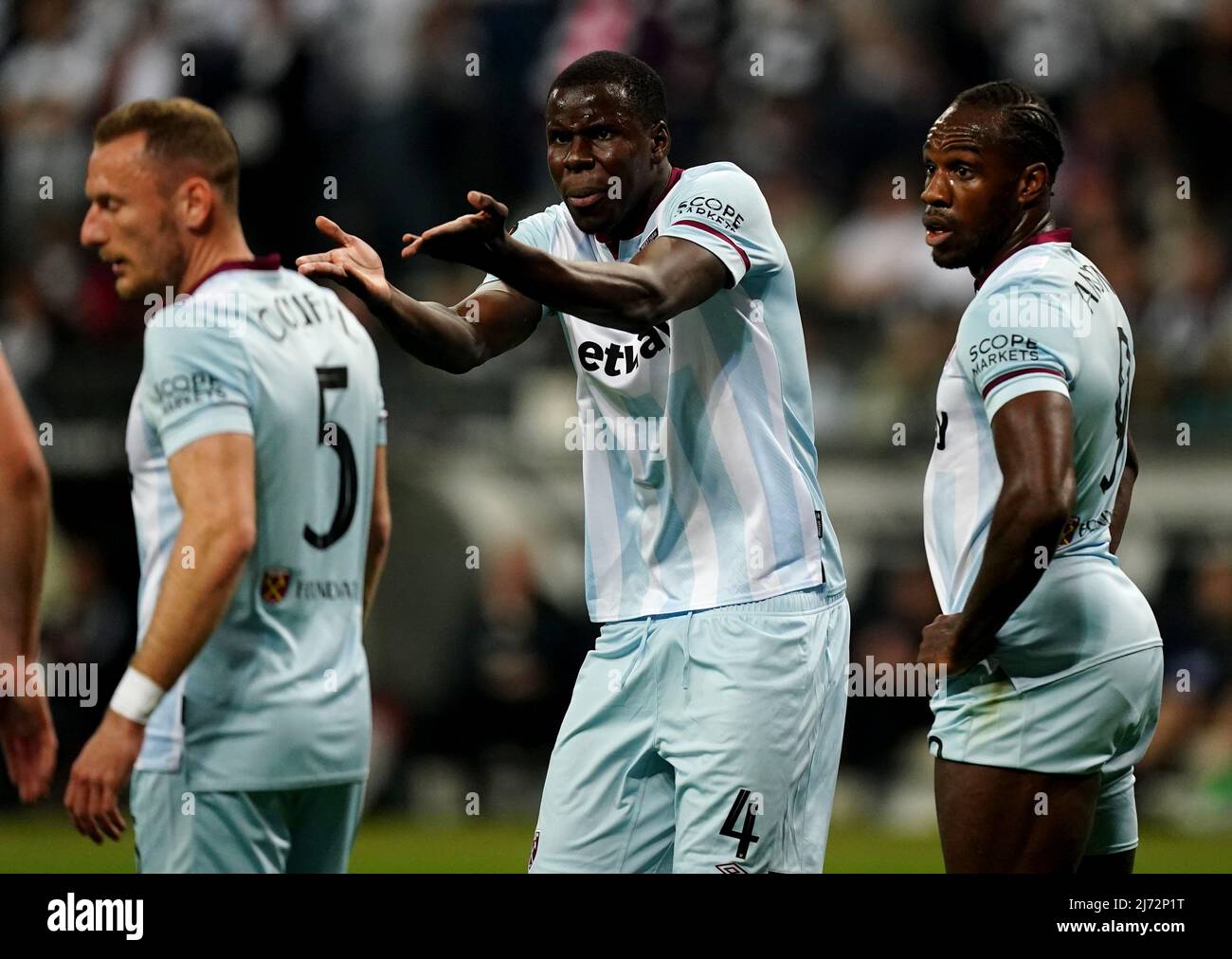 West Ham United's Kurt Zouma speaks with his team mates during the ...