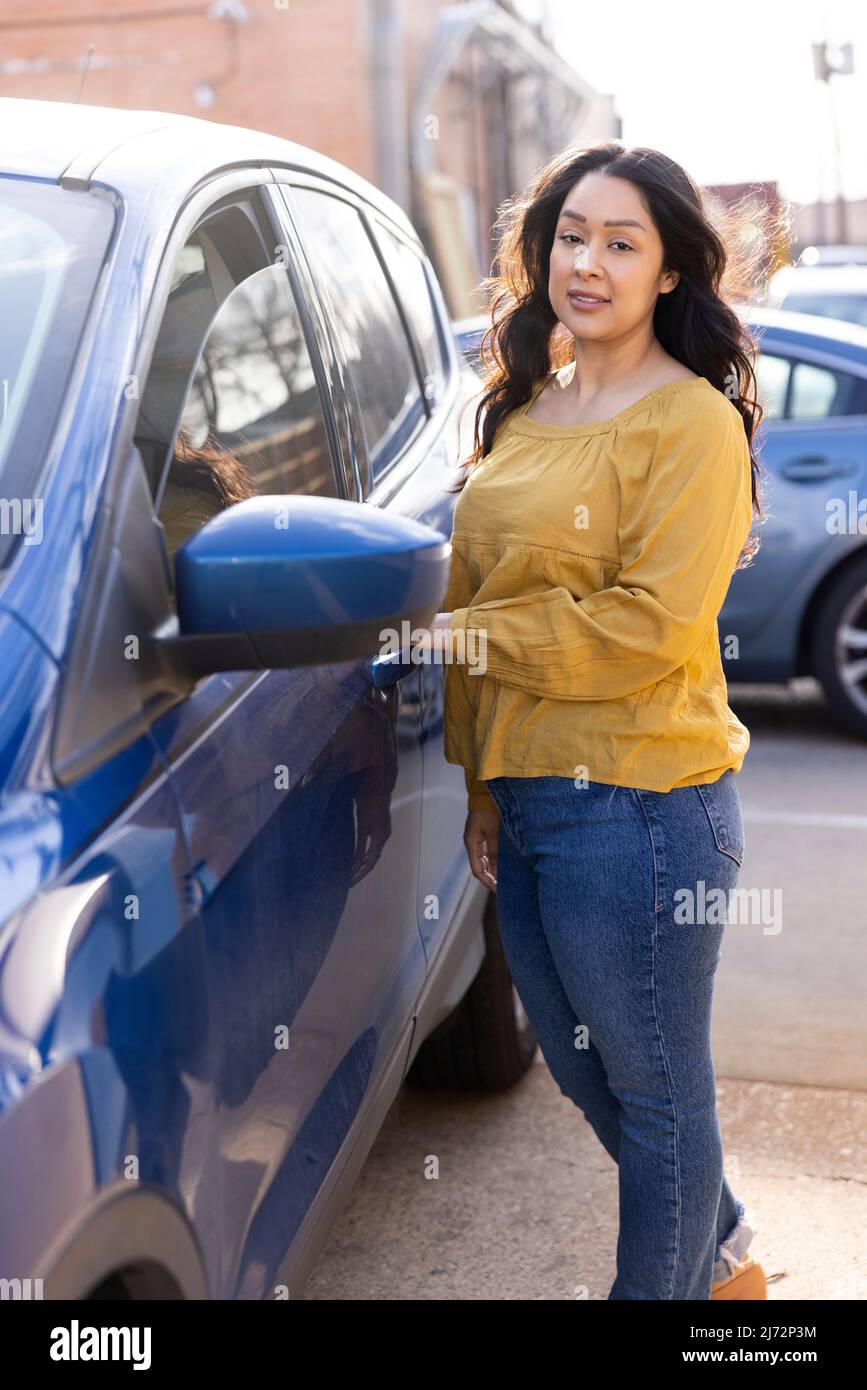 Beautiful young hispanic woman standing hi-res stock photography and ...