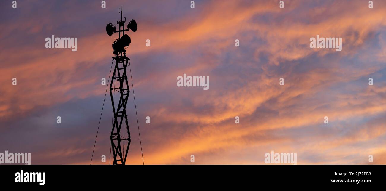 Contour small military radar station on the background of the sunset ...