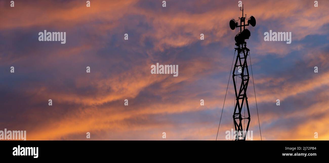 Contour small military radar station on the background of the sunset ...