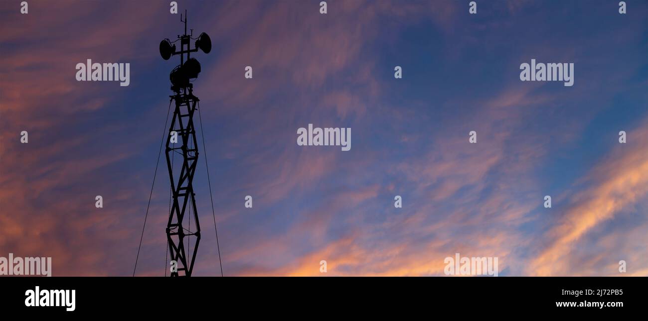 Contour small military radar station on the background of the sunset ...