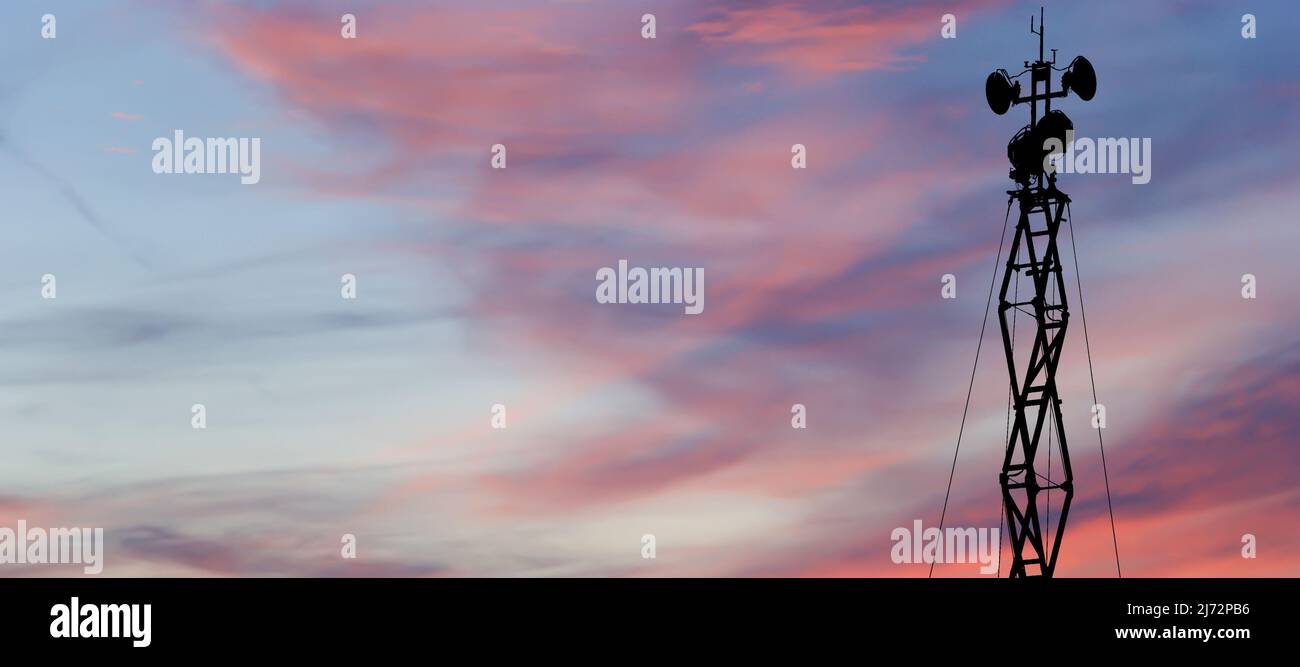 Contour small military radar station on the background of the sunset ...