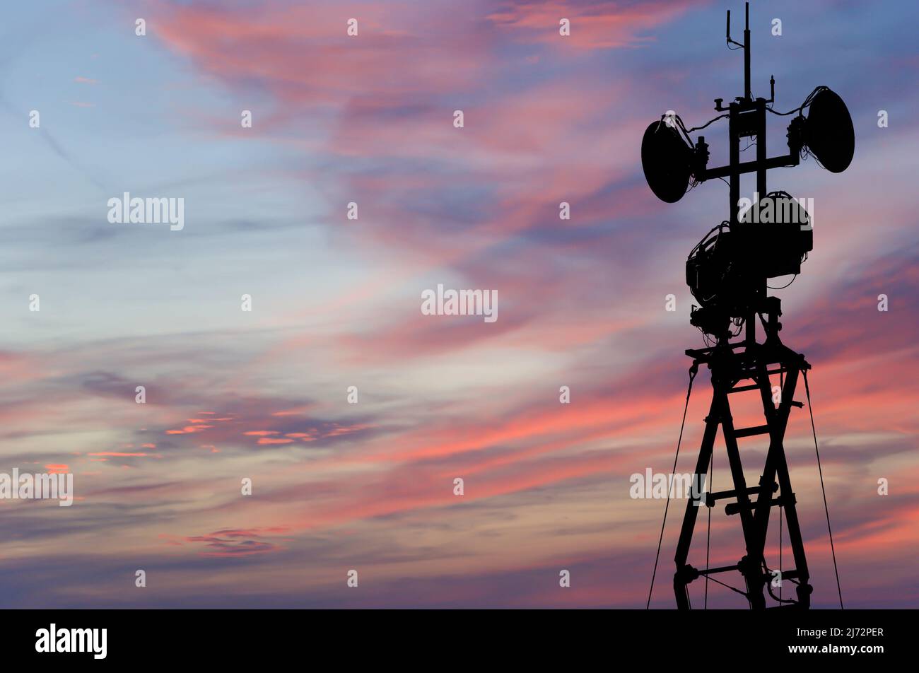 Contour small military radar station on the background of the sunset ...