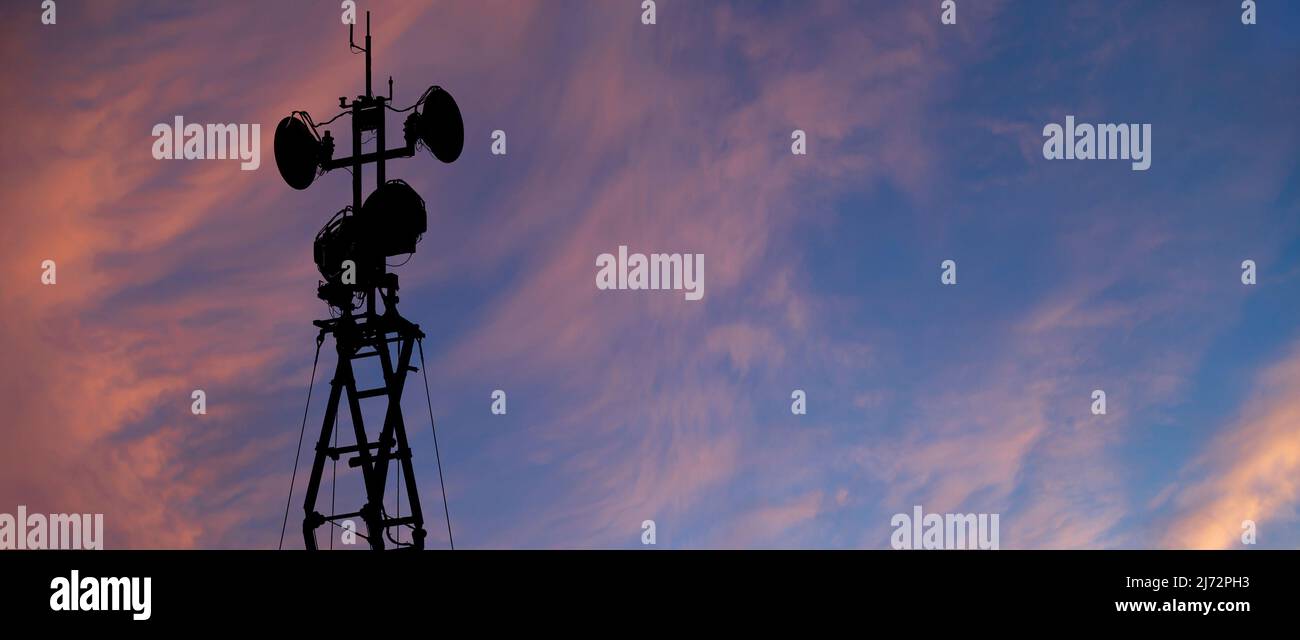 Contour small military radar station on the background of the sunset ...