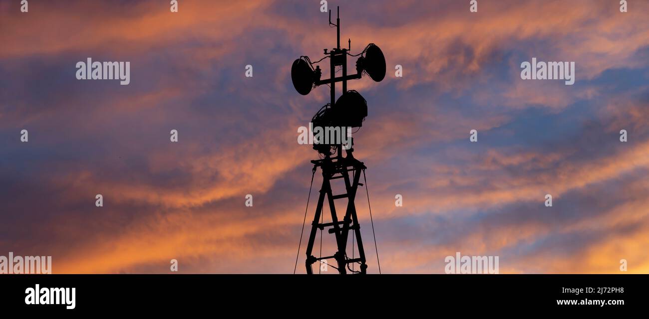 Contour small military radar station on the background of the sunset ...