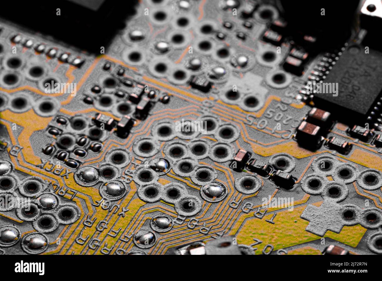 Macro Close up of printed wiring and components on PC circuit board ...
