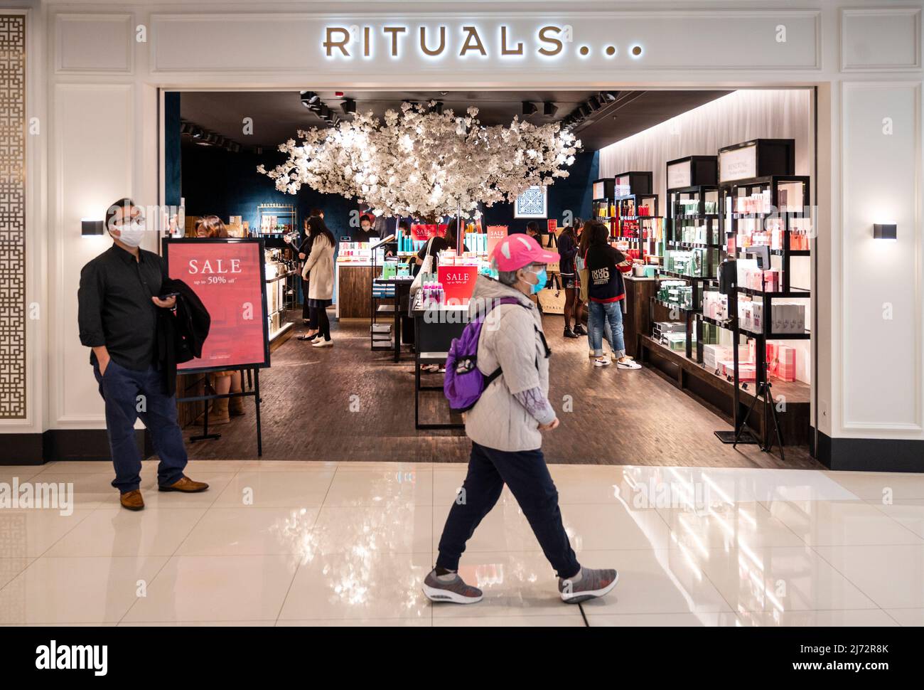 A shopper walks past the Dutch cosmetics brand Rituals store in Hong ...