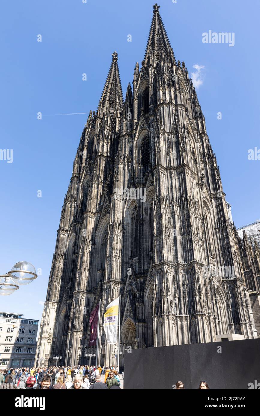 Cologne Cathedral twin towers rising above city skyline on a bright ...