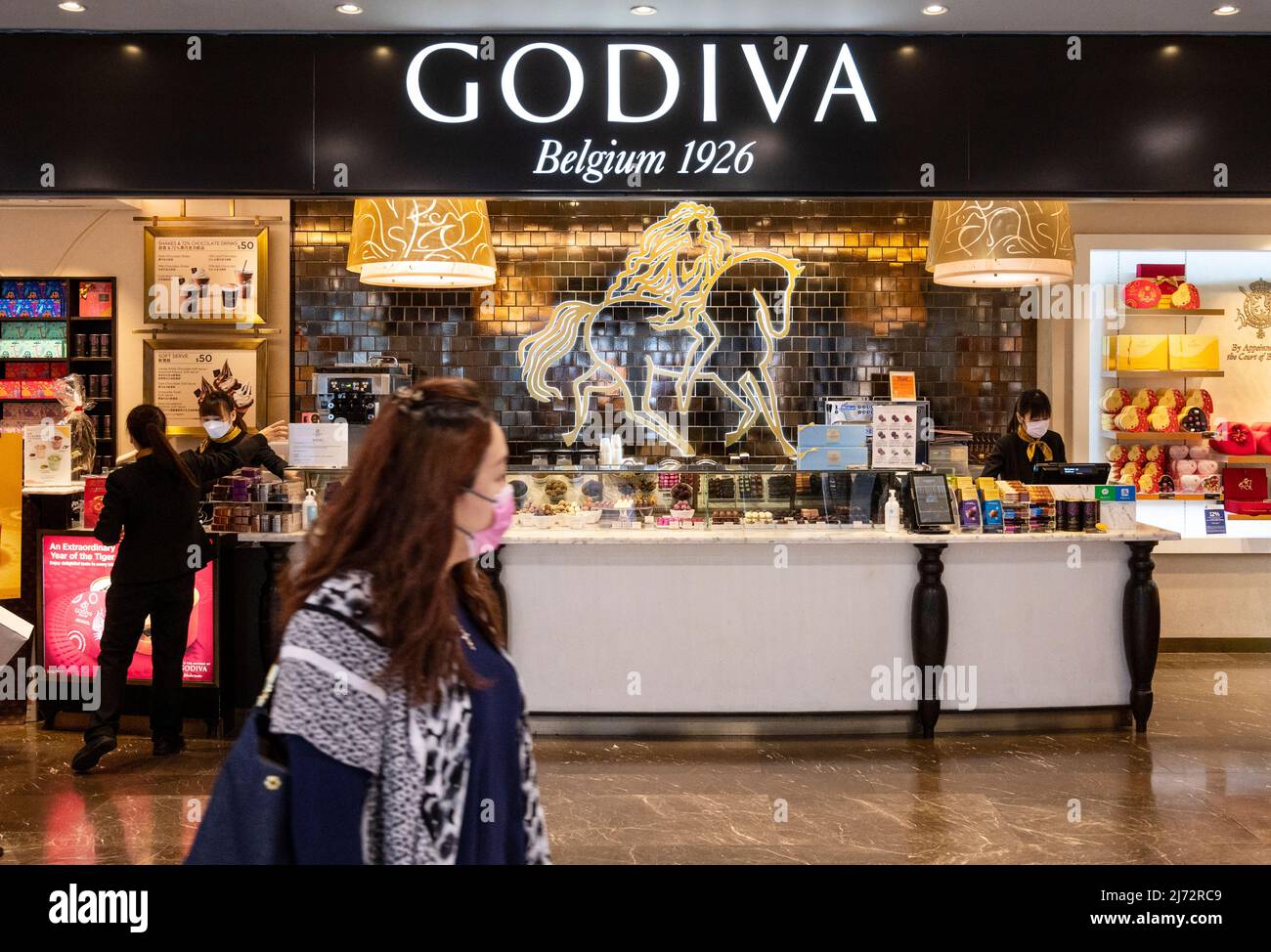 A shopper walks past the Belgian multinational chocolate manufacturer ...