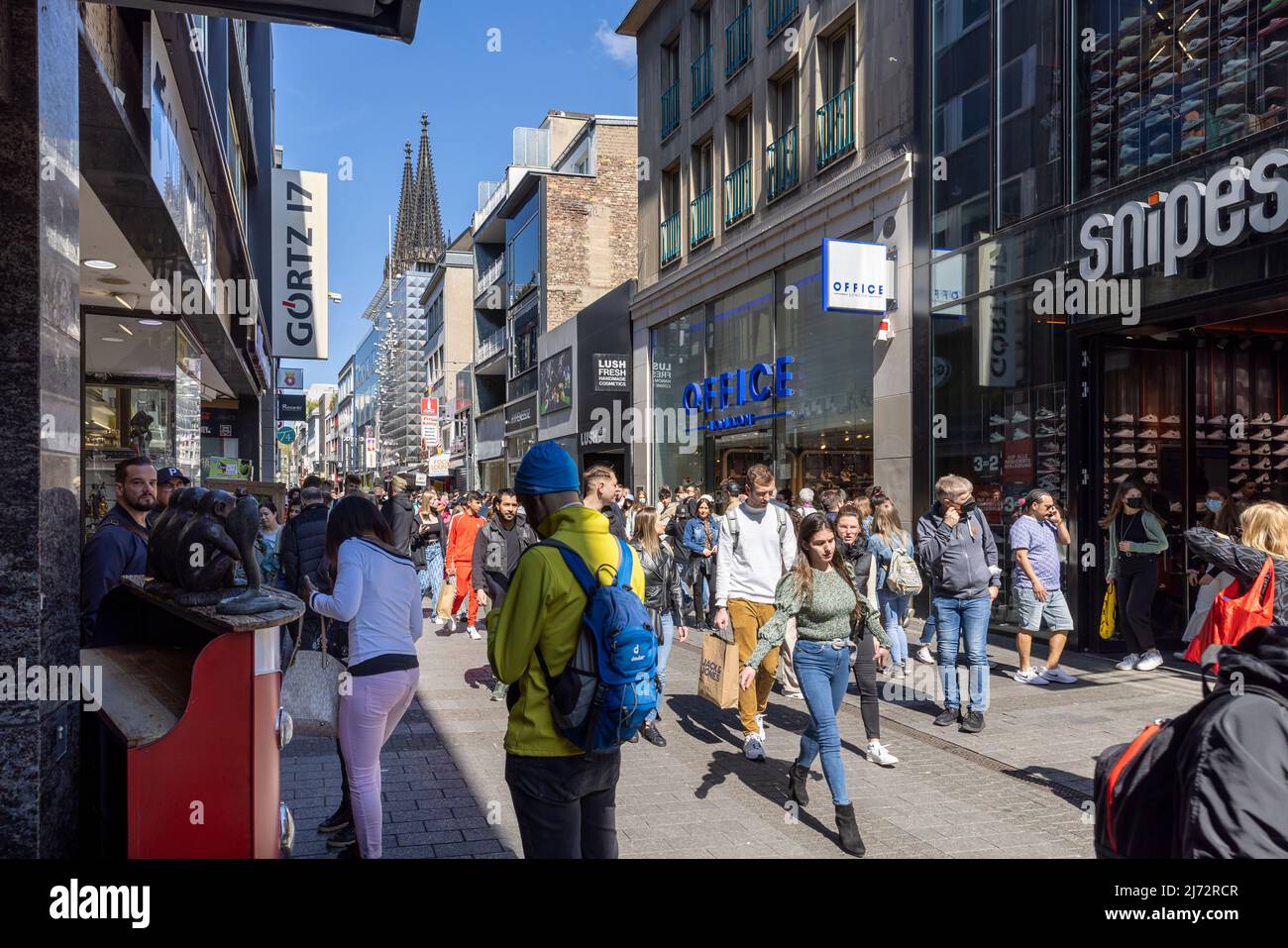 Cologne downtown with tourists walking on streets in a bright spring ...