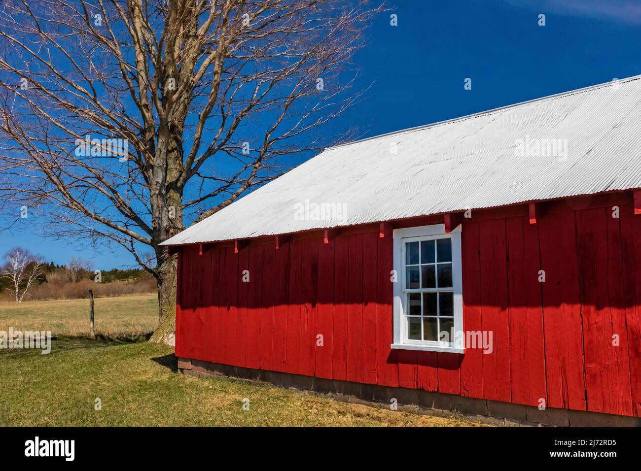 Red barn at Thoreson Farm in Port Oneida Rural Historic District, with barns and outbuilding ...