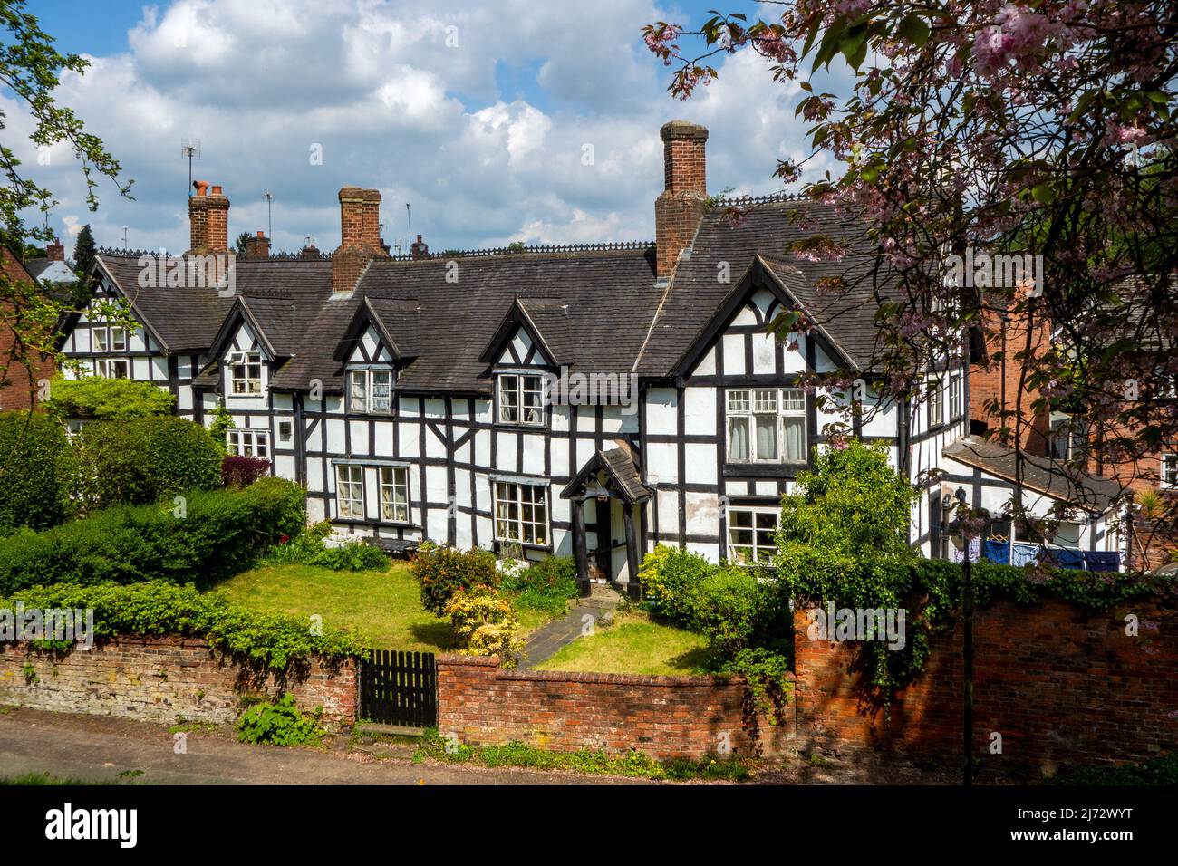 Black and white half timbered cottages in Front Street in the Cheshire ...