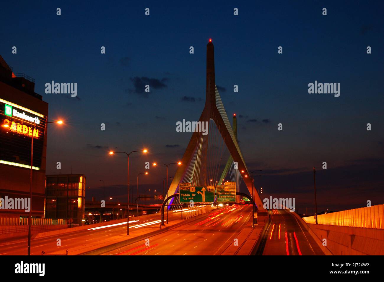 The Zakim Bridge,in Boston, is illuminated at night Stock Photo - Alamy