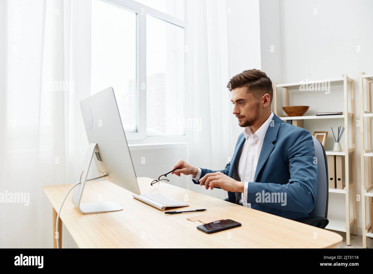 manager sitting at the computer work boss executive Stock Photo - Alamy