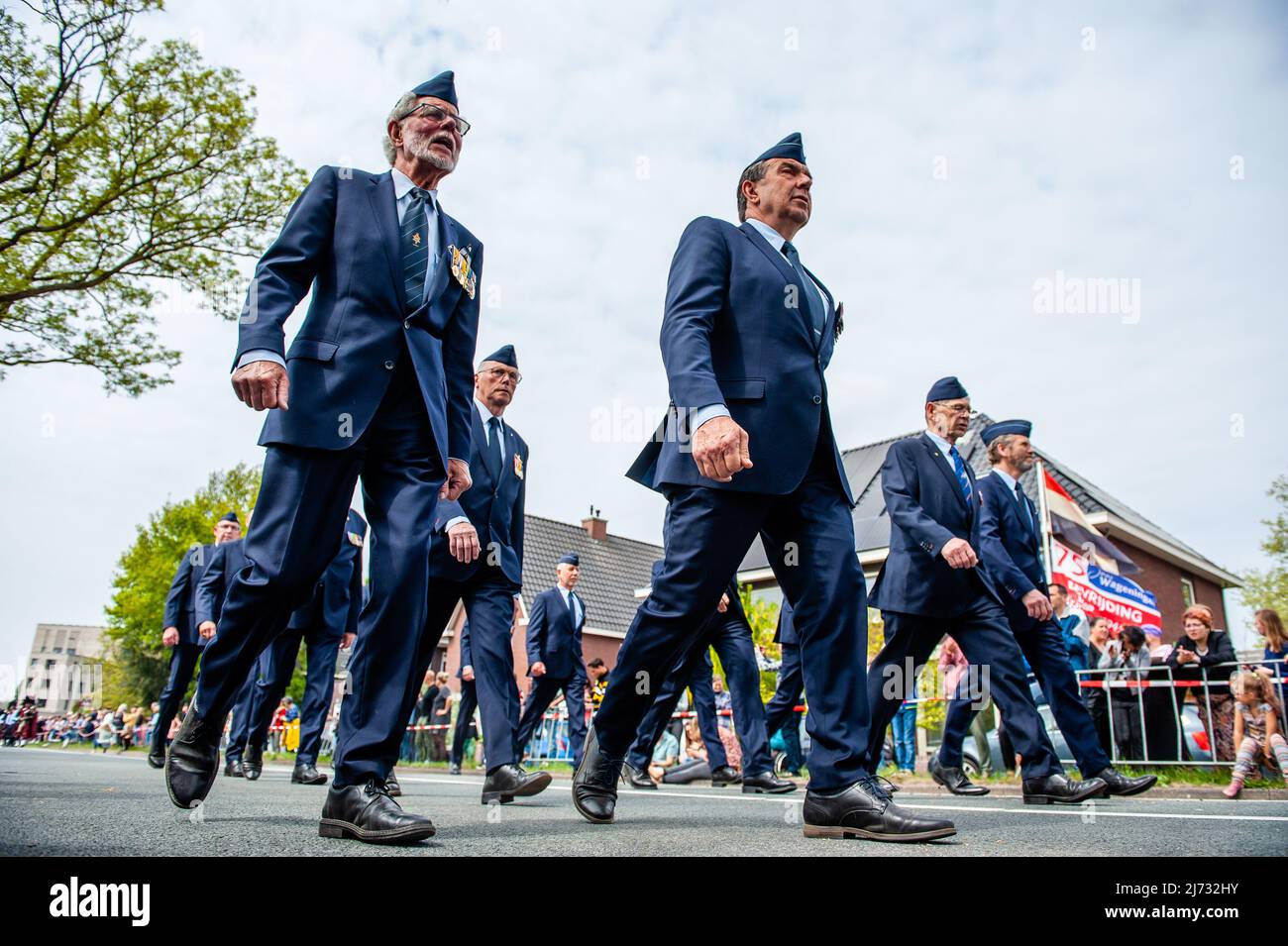 Military officers are seen marching during the Liberation Day parade ...