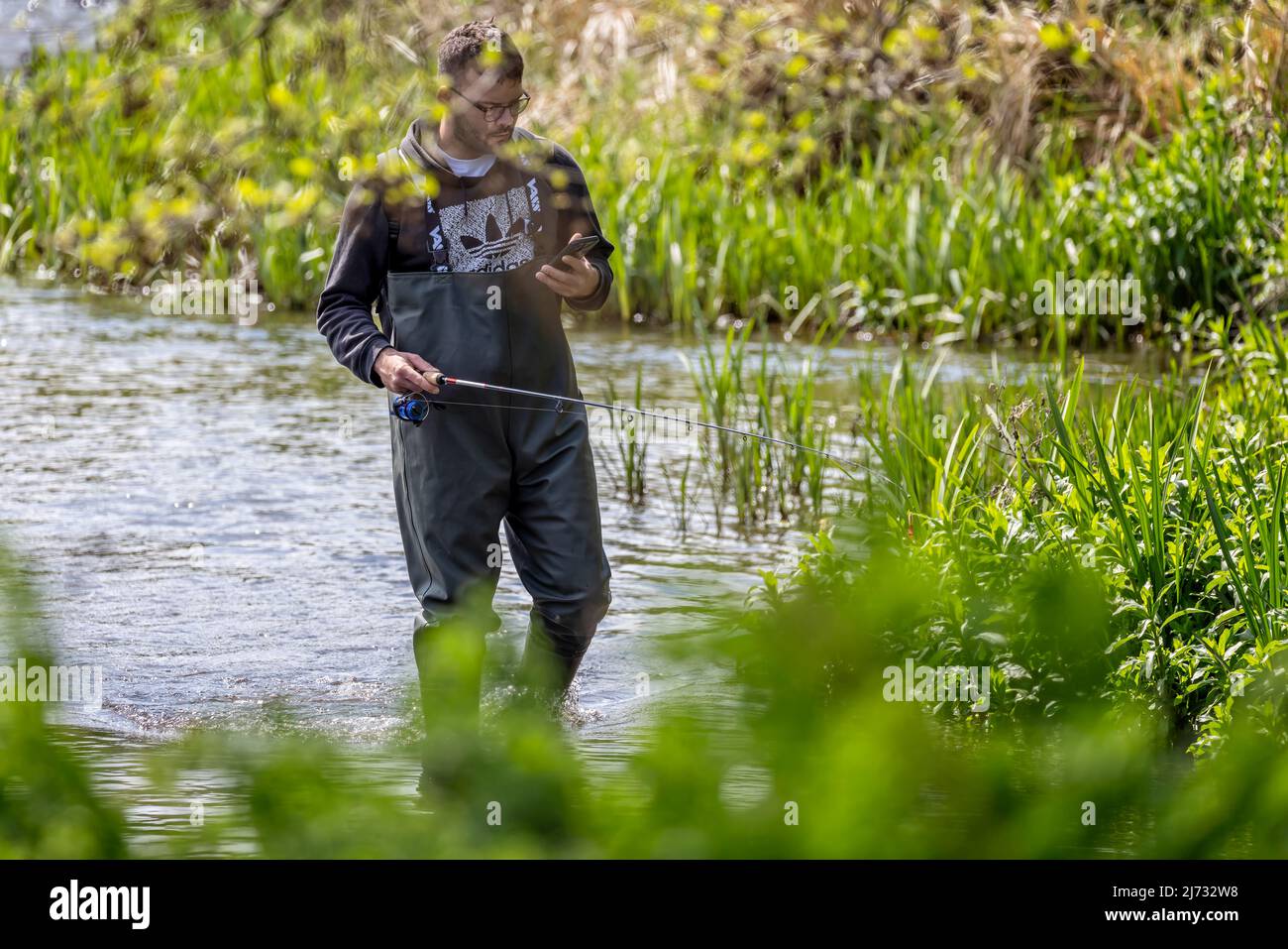 Man wearing waders hi-res stock photography and images - Alamy