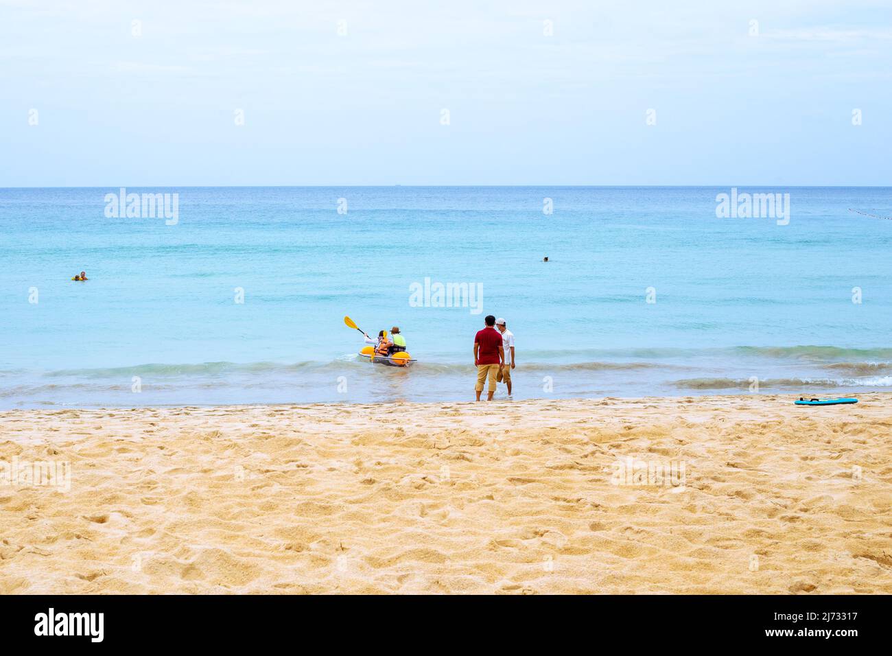 Tourists ride on a transparent boat on the sea. Entertainment on the ...