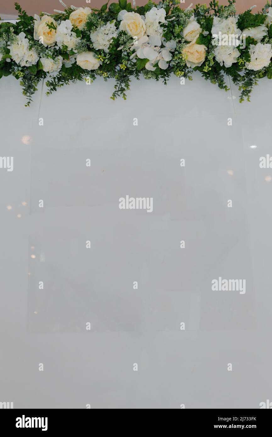 Wedding arch with multi-colored flowers Stock Photo - Alamy