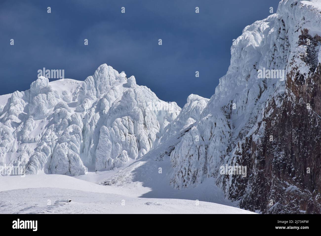 The steep icy summit area of Mt Hood, Oregon's highest mountain, seen ...